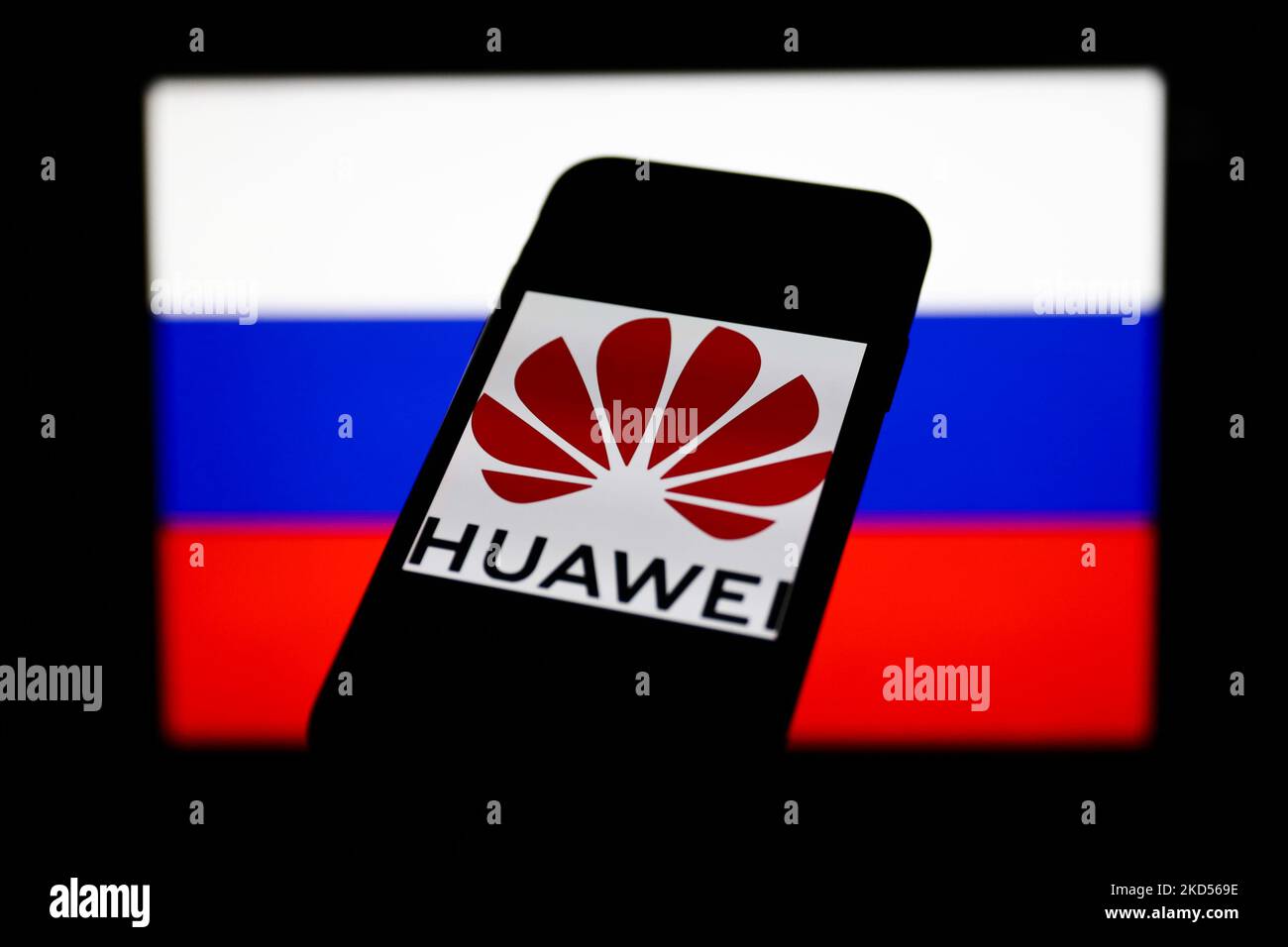 Huawei logo displayed on a phone screen and Russian flag displayed on a ...