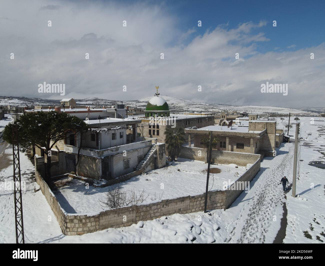 A view from Jabal ez-Zawiya district during snowfall as Syrians ...