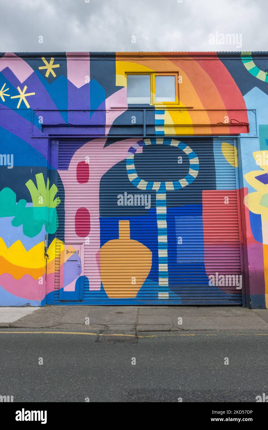 A view of a building wall with colorful art in the center of Dublin ...