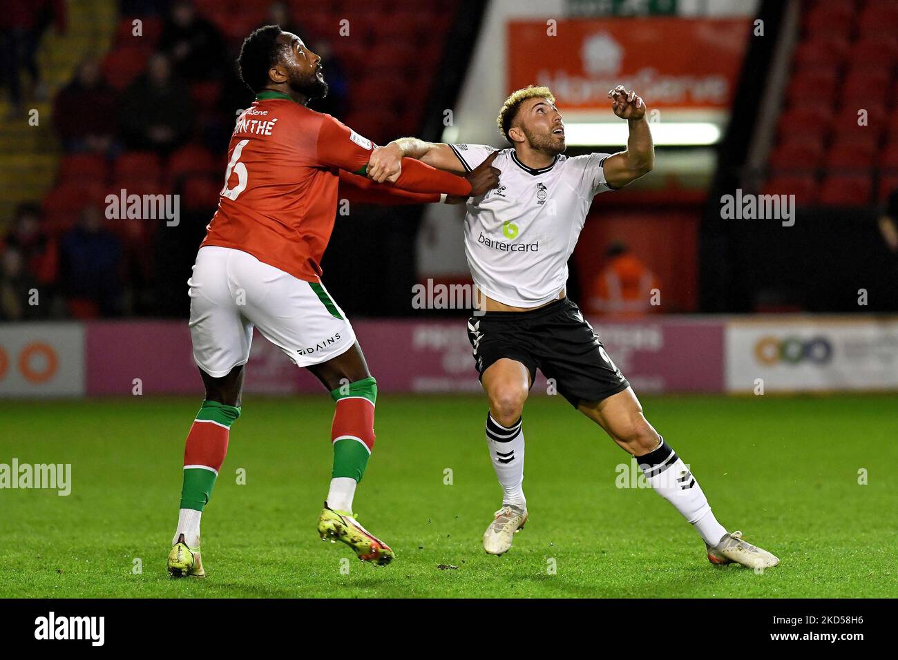 Oldham Athletic's Hallam Hope tussles with Emmanuel Monthe during the ...