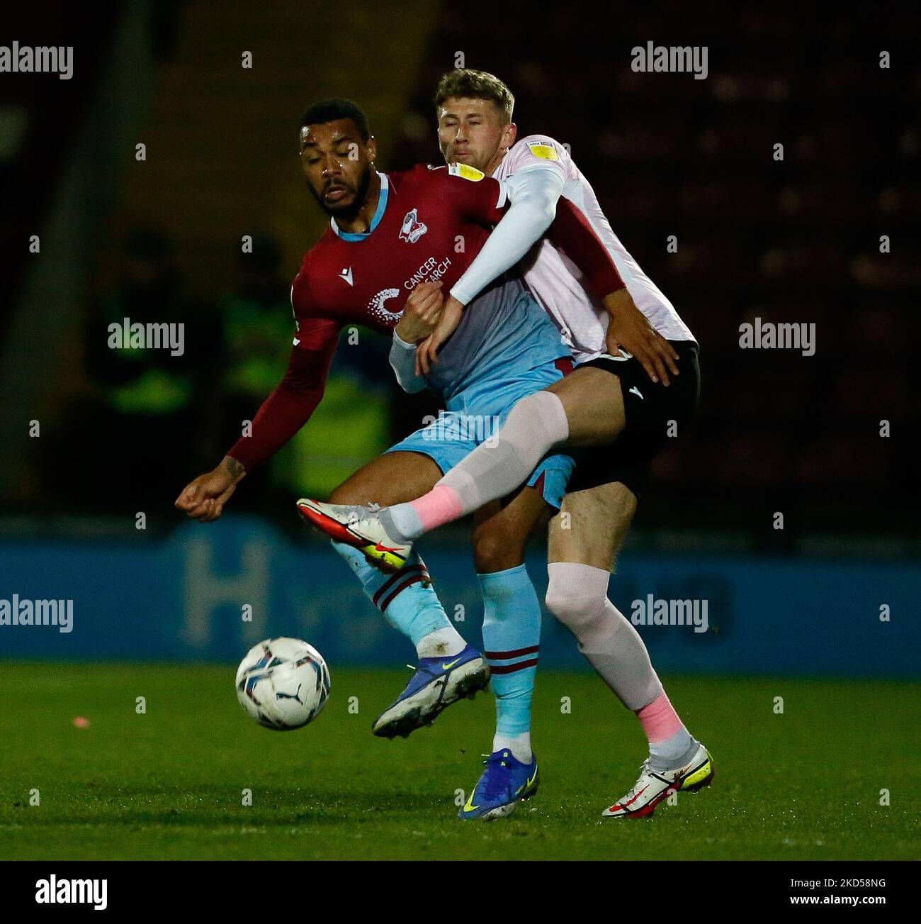 Patrick Brough of Barrow and Joe Nuttall of Scunthorpe United in action ...