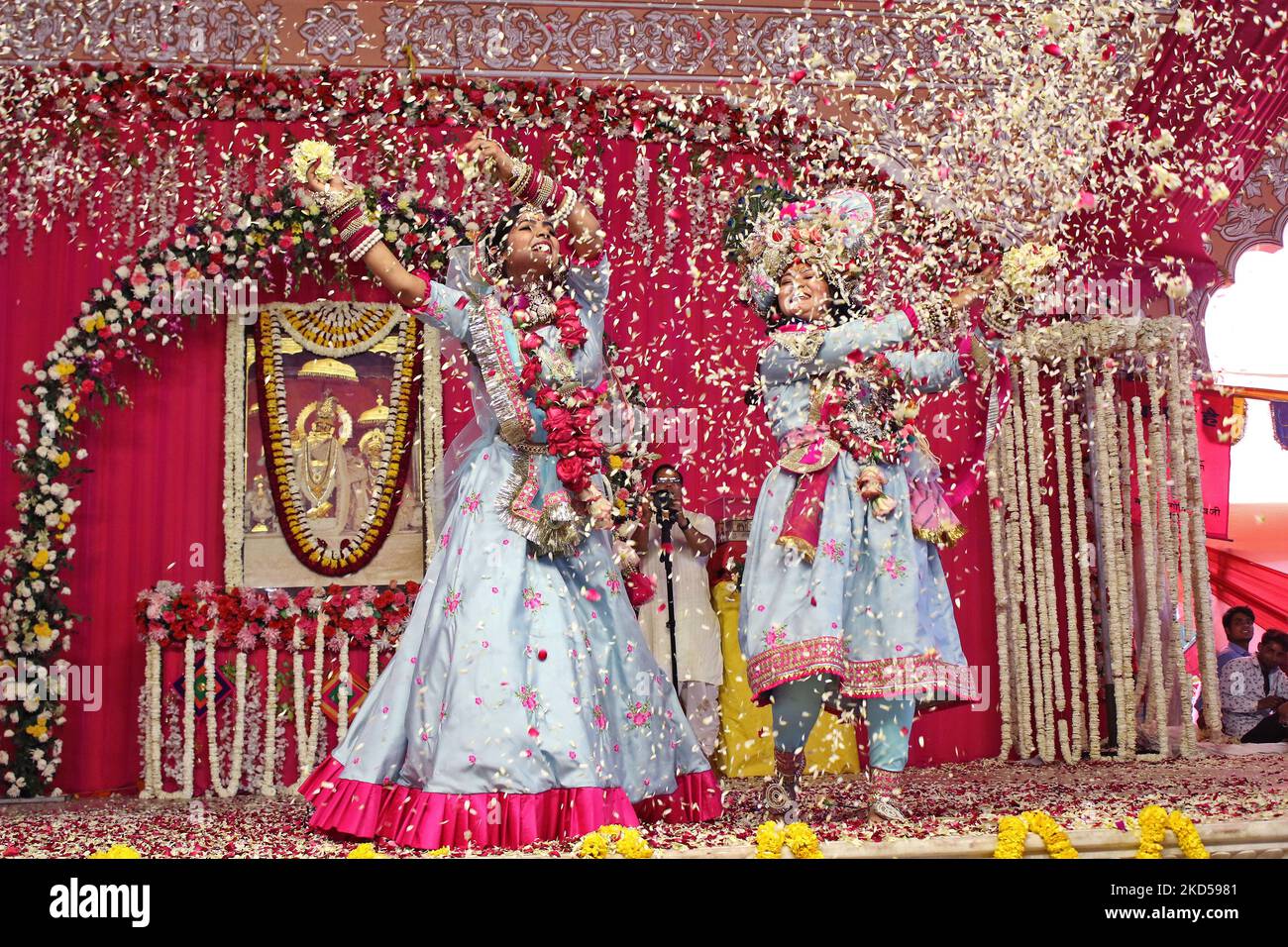 Artists dressed as Lord Krishna and Goddess Radha perform during the ...