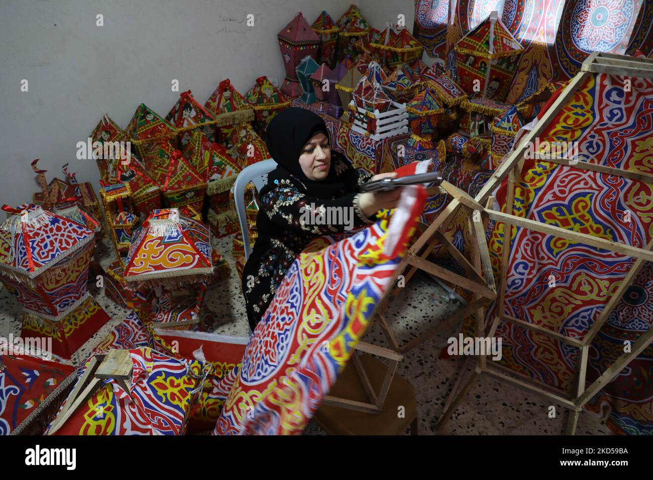 Palestinian woman Reham Shurab makes a traditional lantern, called a ...