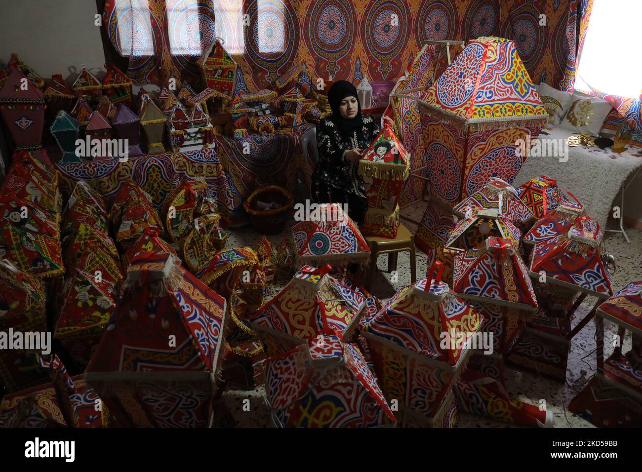 Palestinian woman Reham Shurab makes a traditional lantern, called a ...