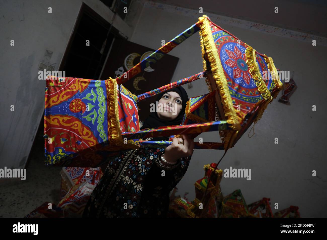 Palestinian woman Reham Shurab makes a traditional lantern, called a ...