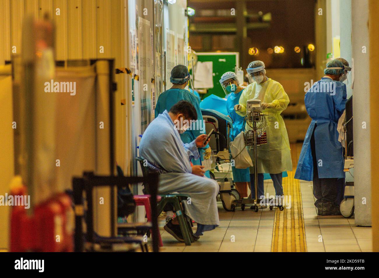 Nurses assist patients in an outdoor triage area at the Accident ...