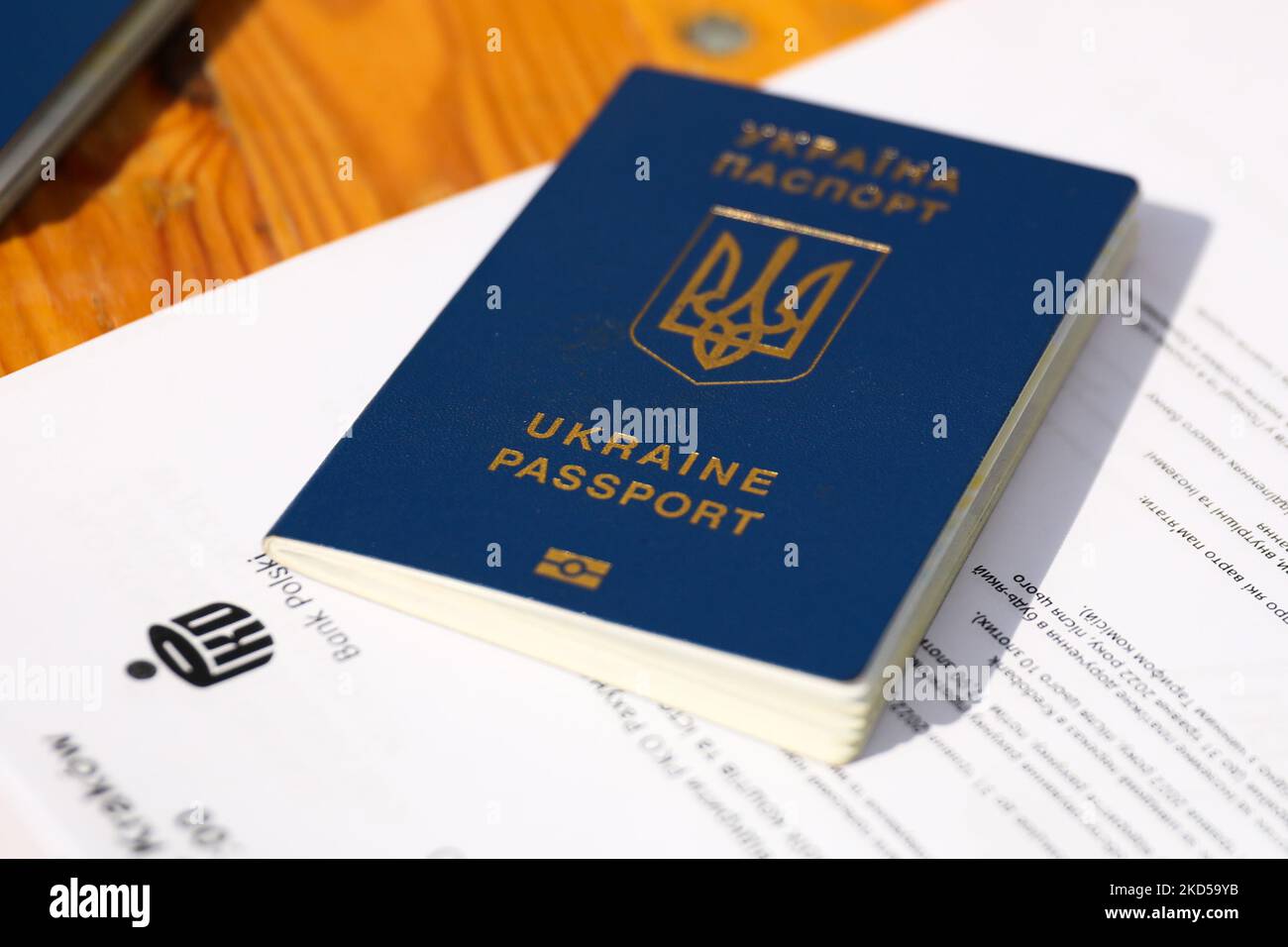 Ukraine passport is seen at the register point at Tauron Arena while ...