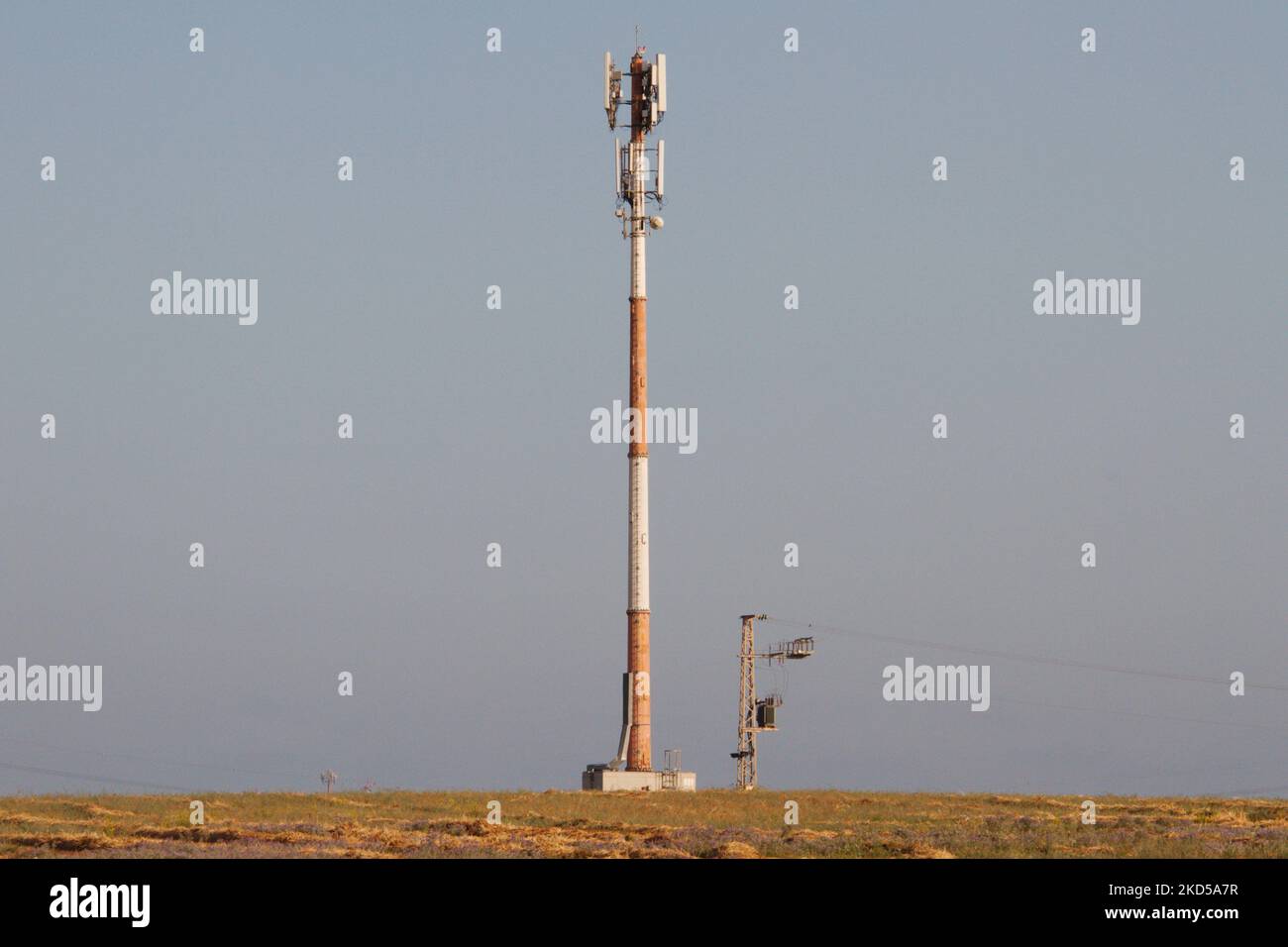 An automated weather observation system in the field on blue sky ...