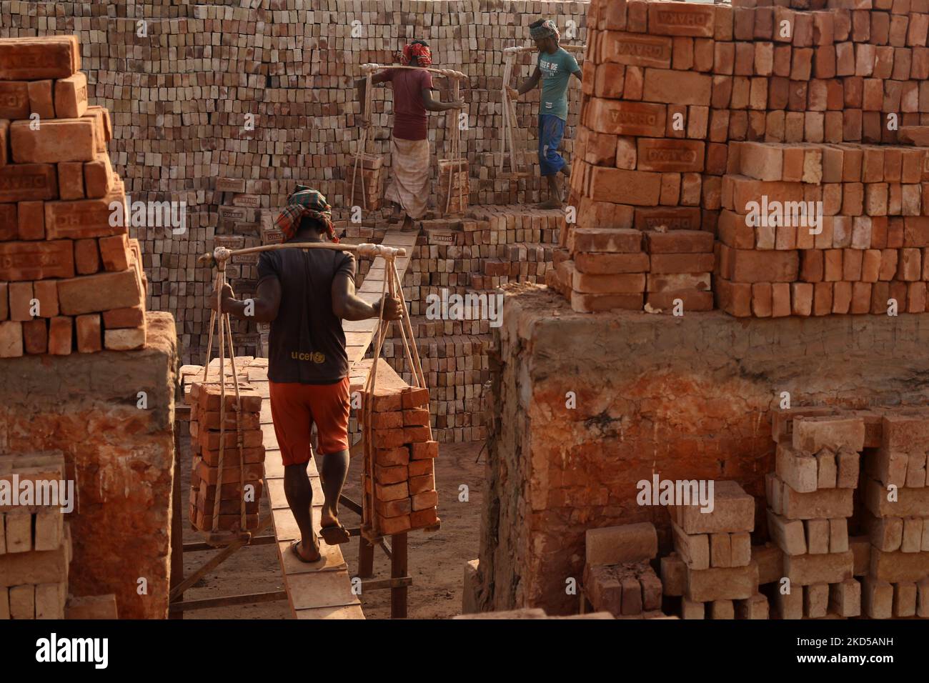 Seasonal Migrant workers during work at a brick-making field in Dhaka ...