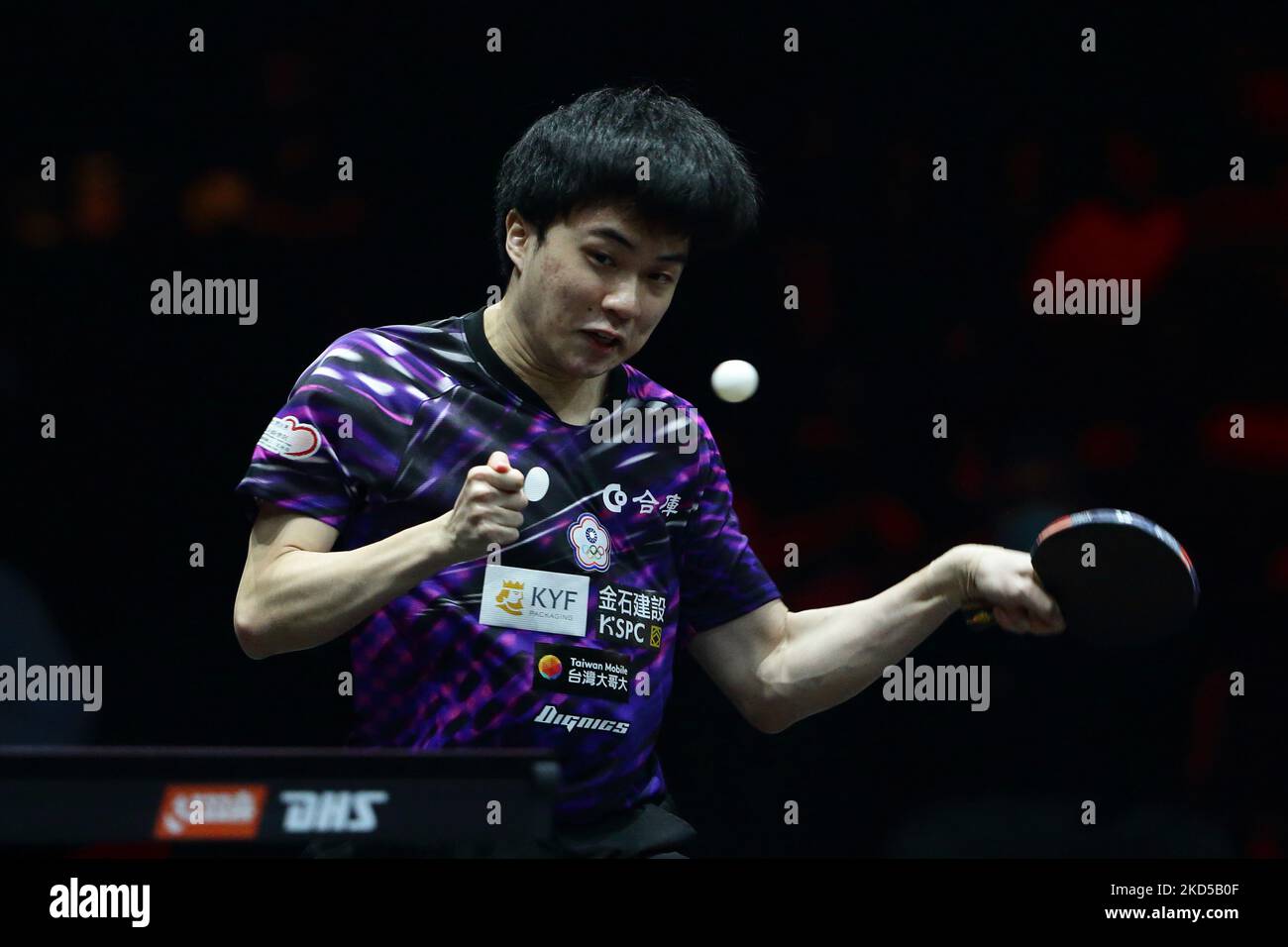 Lin Yun-Ju of Chinese Taipei plays a shot against Ma Long of China ...