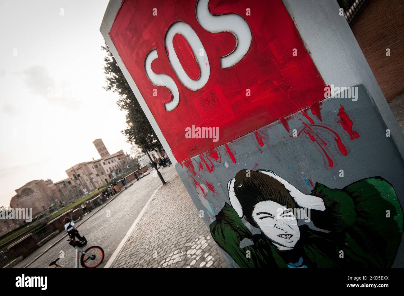 A mural depicting a Ukrainian child under the SOS writing, created by ...