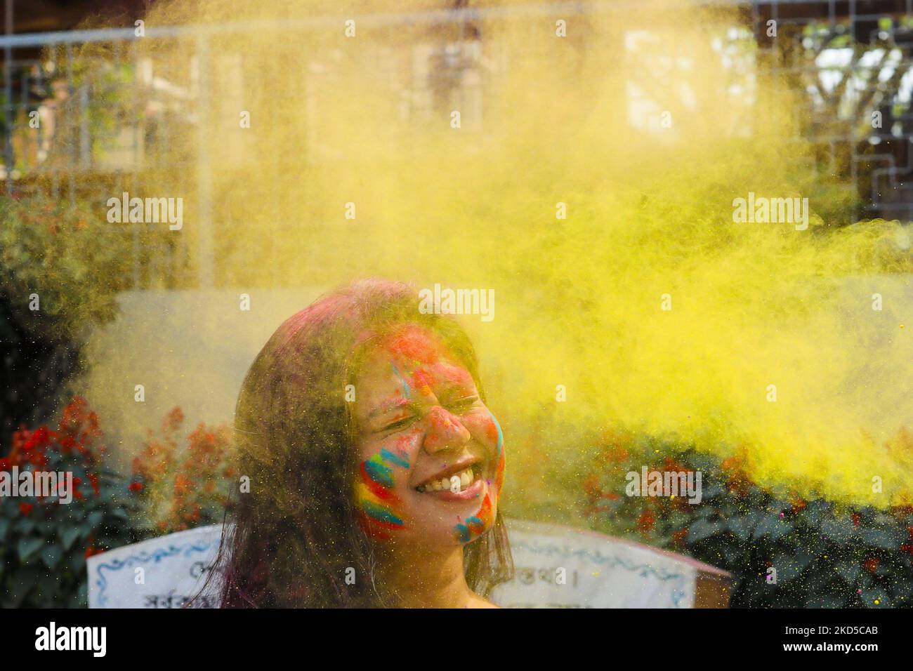 People spread abir (powdered colour) celebrating Dol Purnima festival in Dhaka, Bangladesh on ...