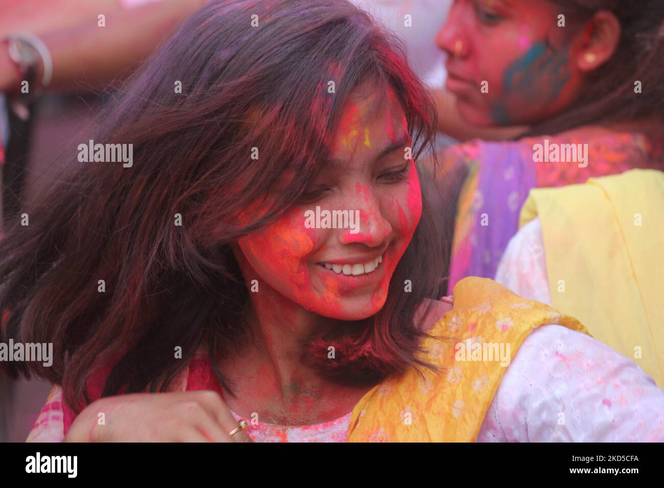 Students play with dry colours during Holi festival in Guwahati, India ...