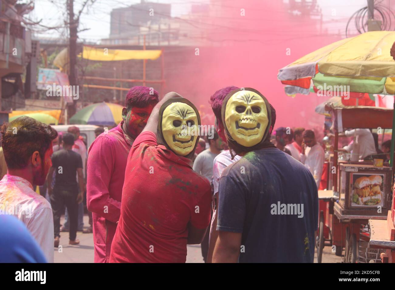People celebrate Holi festival at Fancy Bazar, in Guwahati, India on ...