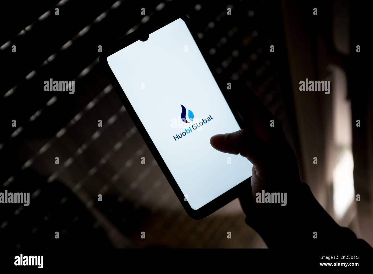 In this photo illustration a Huobi Global logo seen displayed on a ...