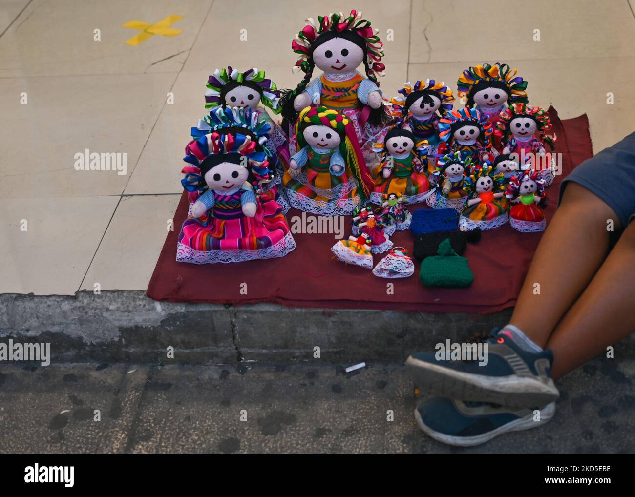 A street vendor selling dolls in the center of San Francisco de ...