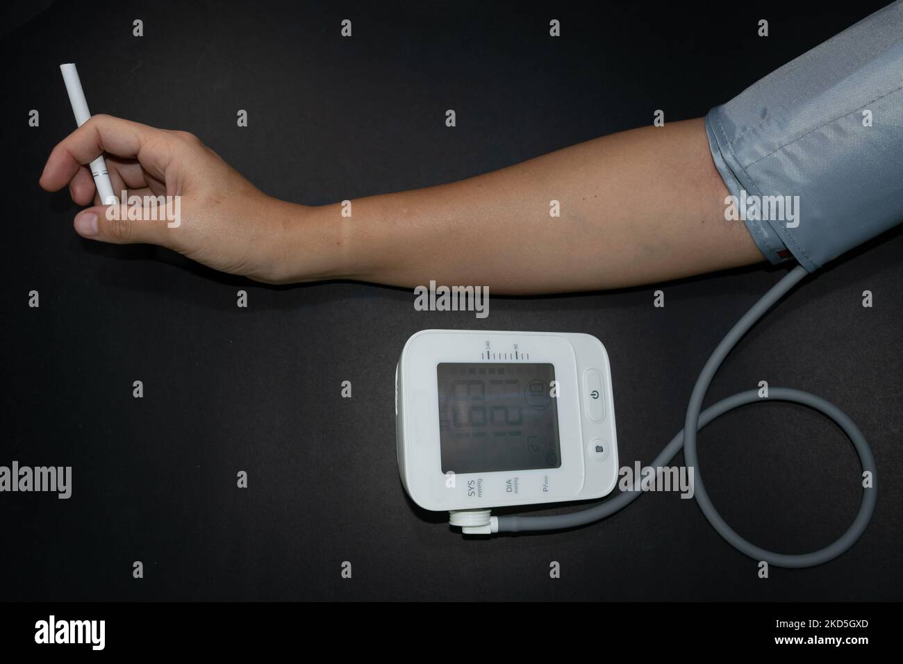 young woman measuring her blood pressure, alcoholic beverages and their ...