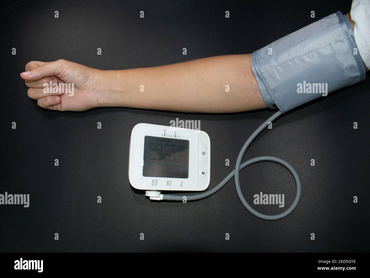 young woman measuring her blood pressure, alcoholic beverages and their ...