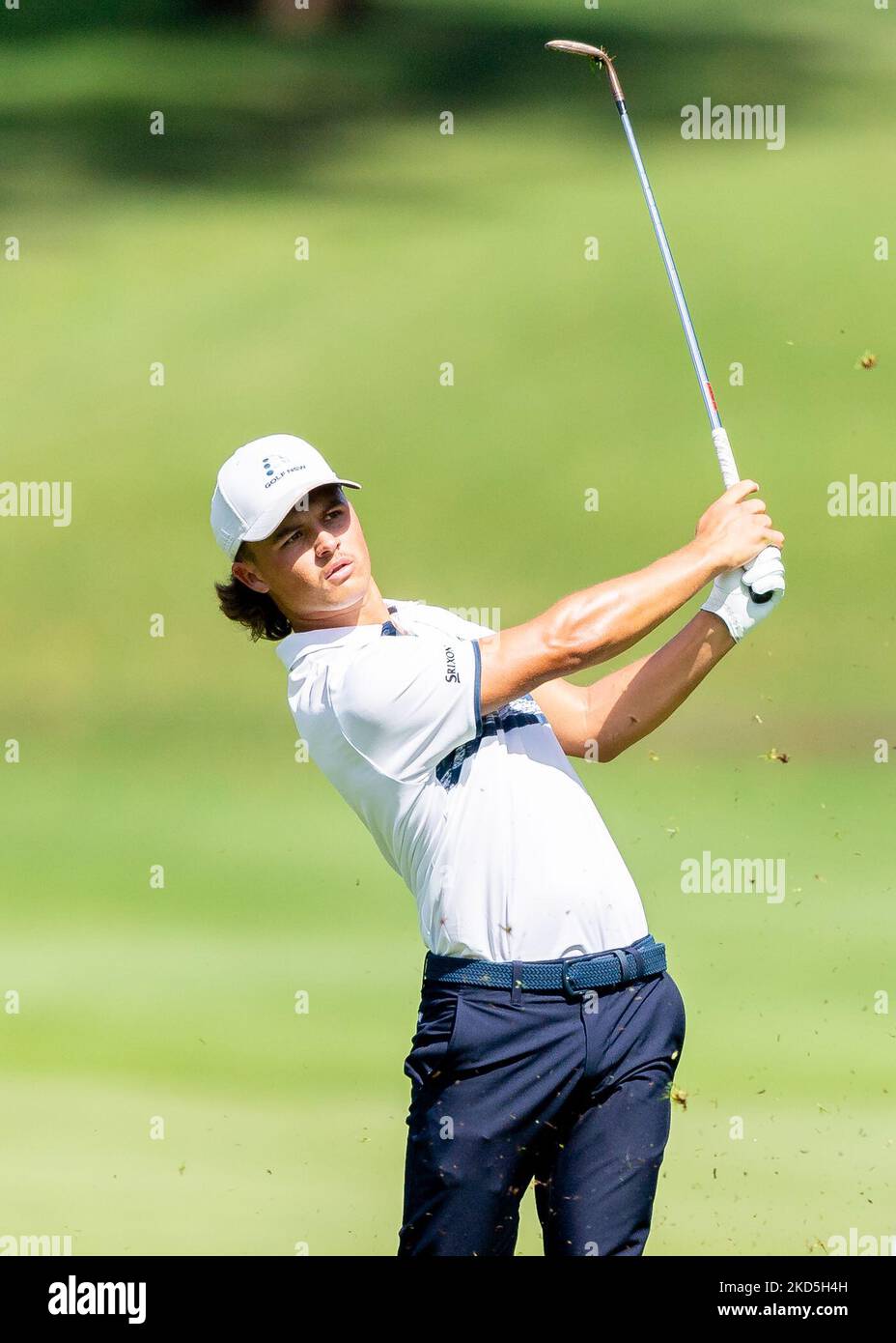 Harrison Crowe (A) of Australia plays his 2nd shot on the 1st hole ...