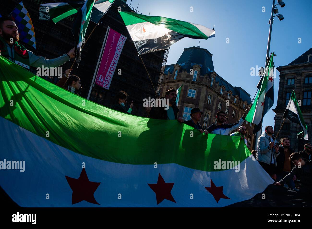 Syrian people are holding Syrian flags, during a demonstration Eleven ...