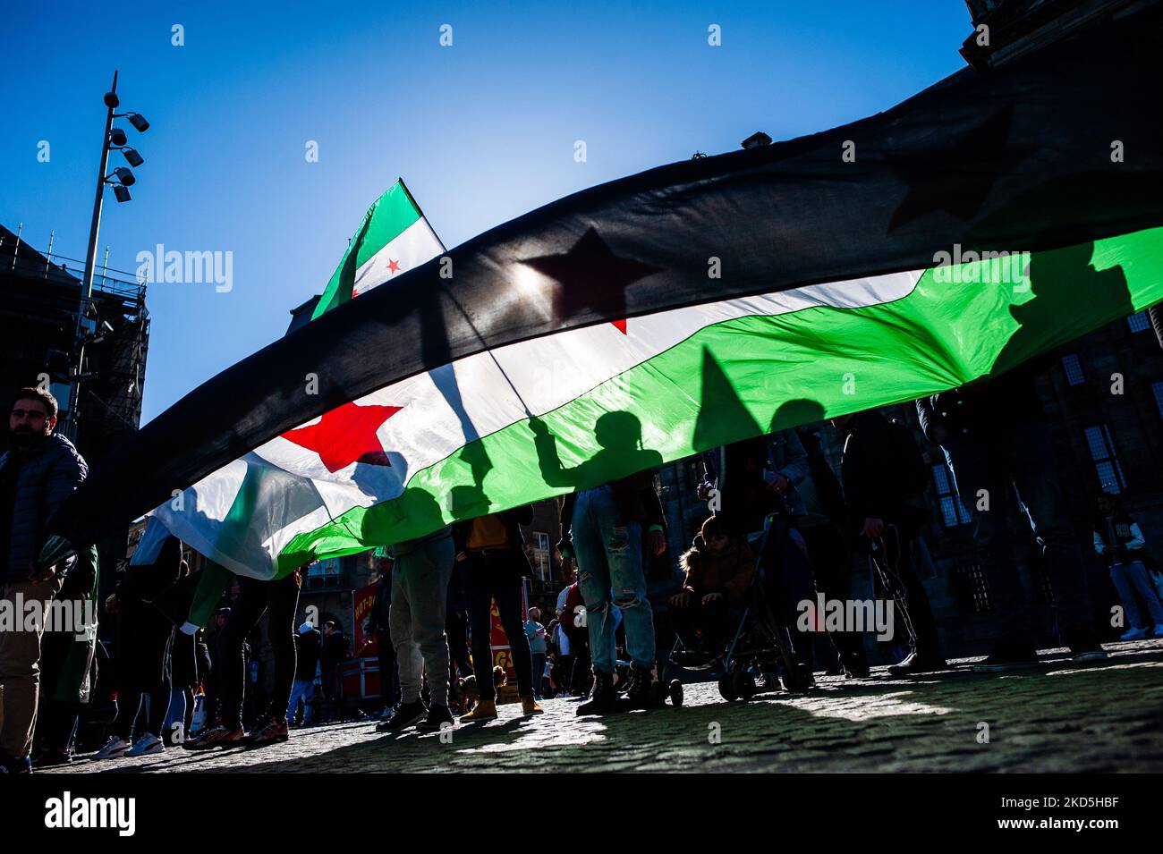 Syrian people are holding Syrian flags, during a demonstration Eleven ...