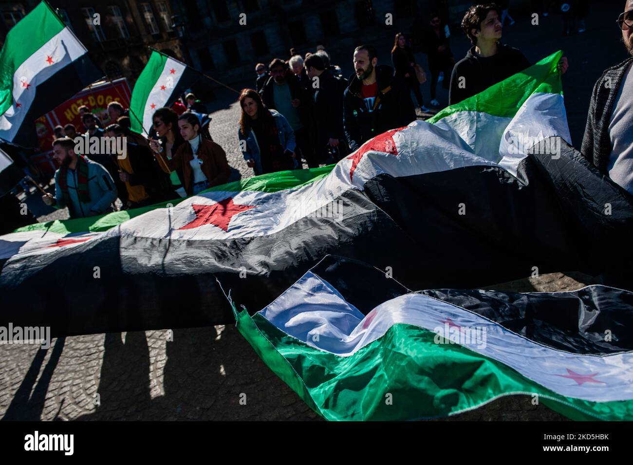 Syrian people are holding Syrian flags, during a demonstration Eleven ...