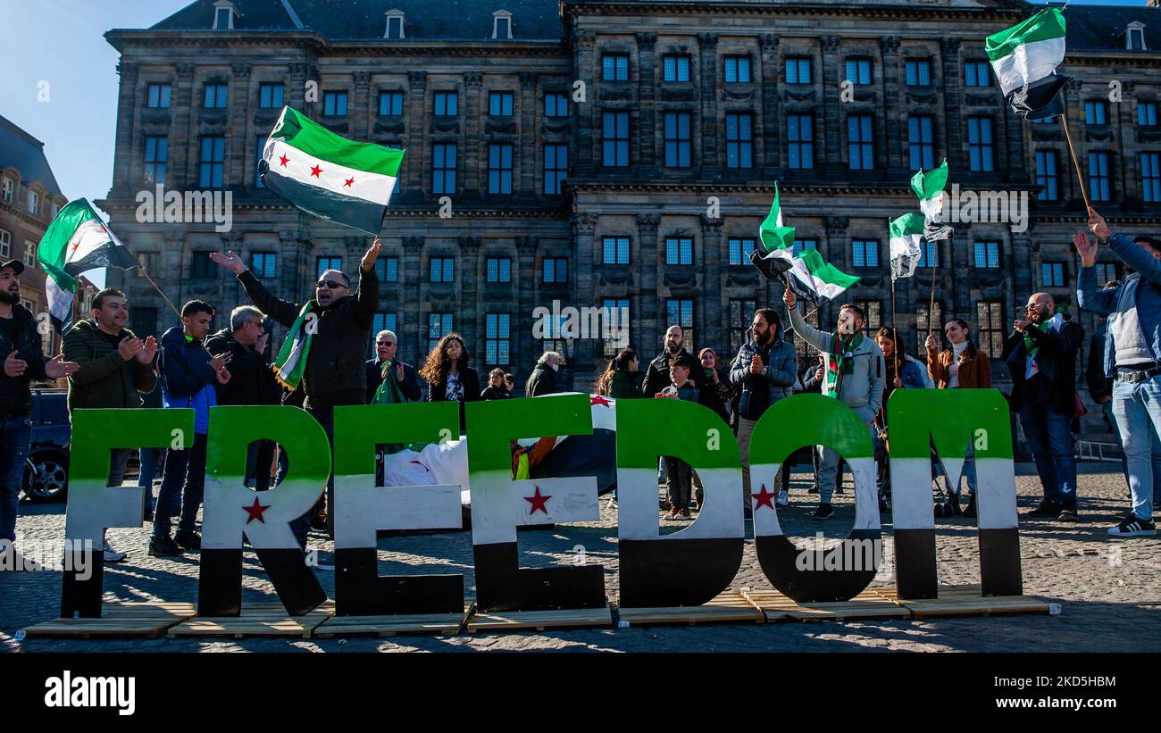 Syrian people are holding Syrian flags, during a demonstration Eleven ...
