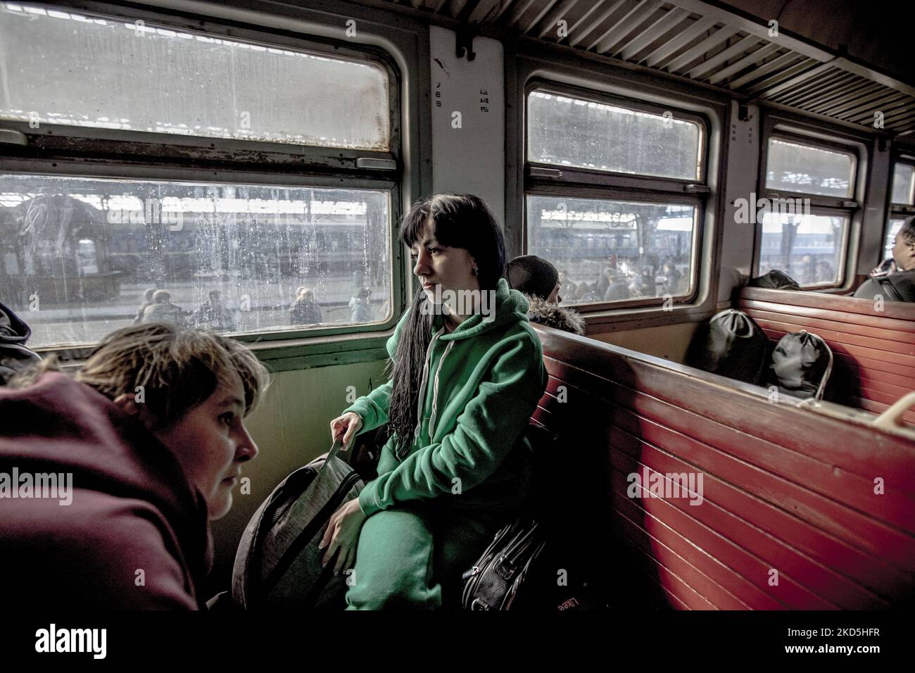 Young women fleeing the country due to the war, as seen waiting the ...