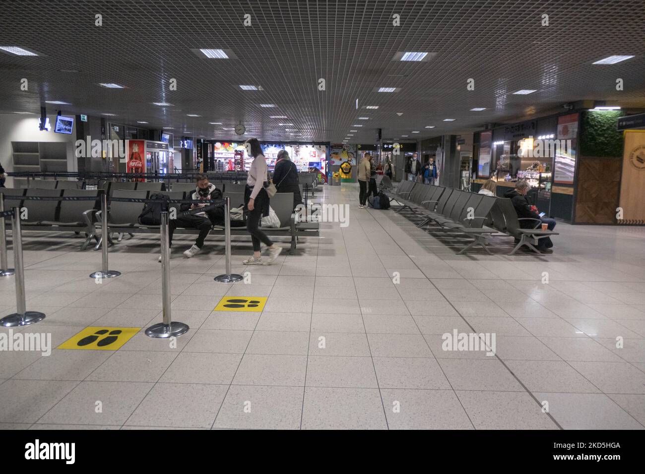 Passengers are seen around the GATE area in Kraków John Paul II ...