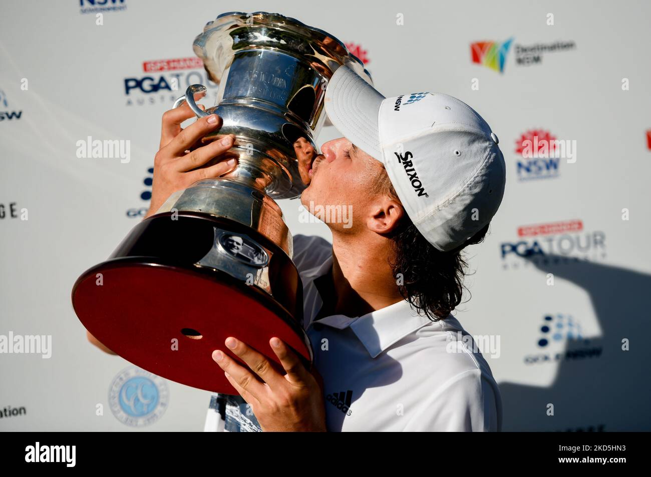 Harrison Crowe (A) of Australia kisses his trophy after winning the ...