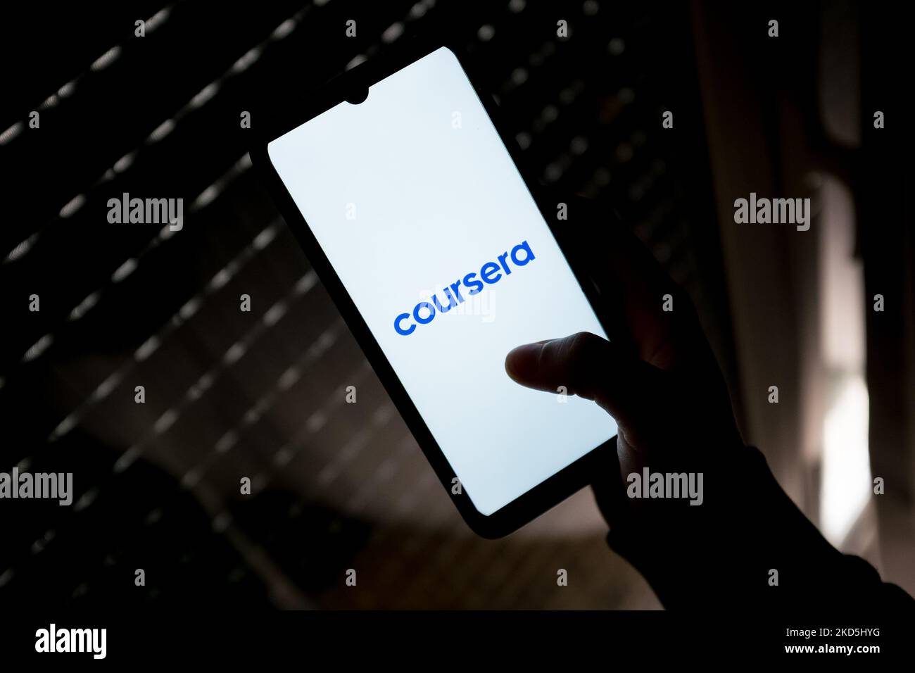 In this photo illustration a Coursera logo seen displayed on a ...