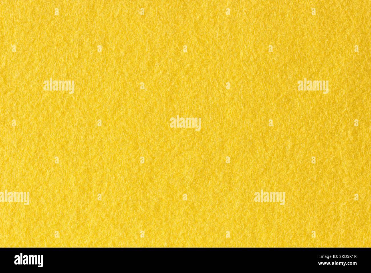 Yellow hue color felt textile fabric texture background Stock Photo - Alamy