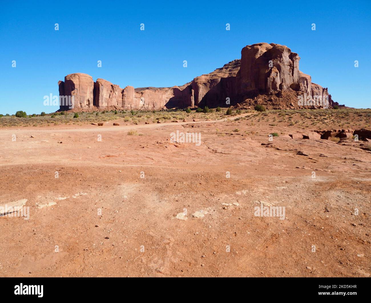 The rocky mountain formation in the Monument Valley on a hot sunny day ...