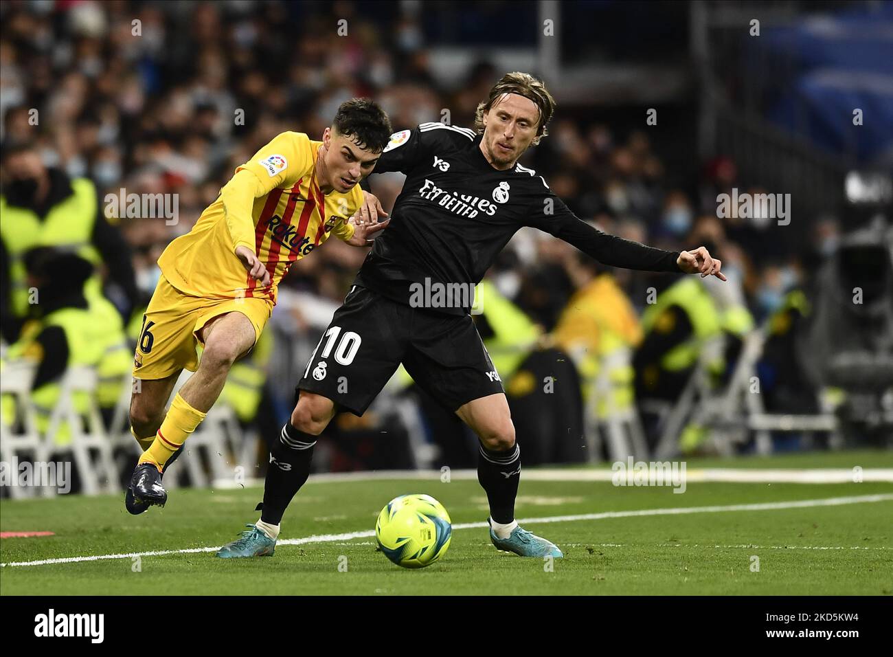 Pedri of Barcelona and Luka Modric of Real Madrid compete for the ball ...