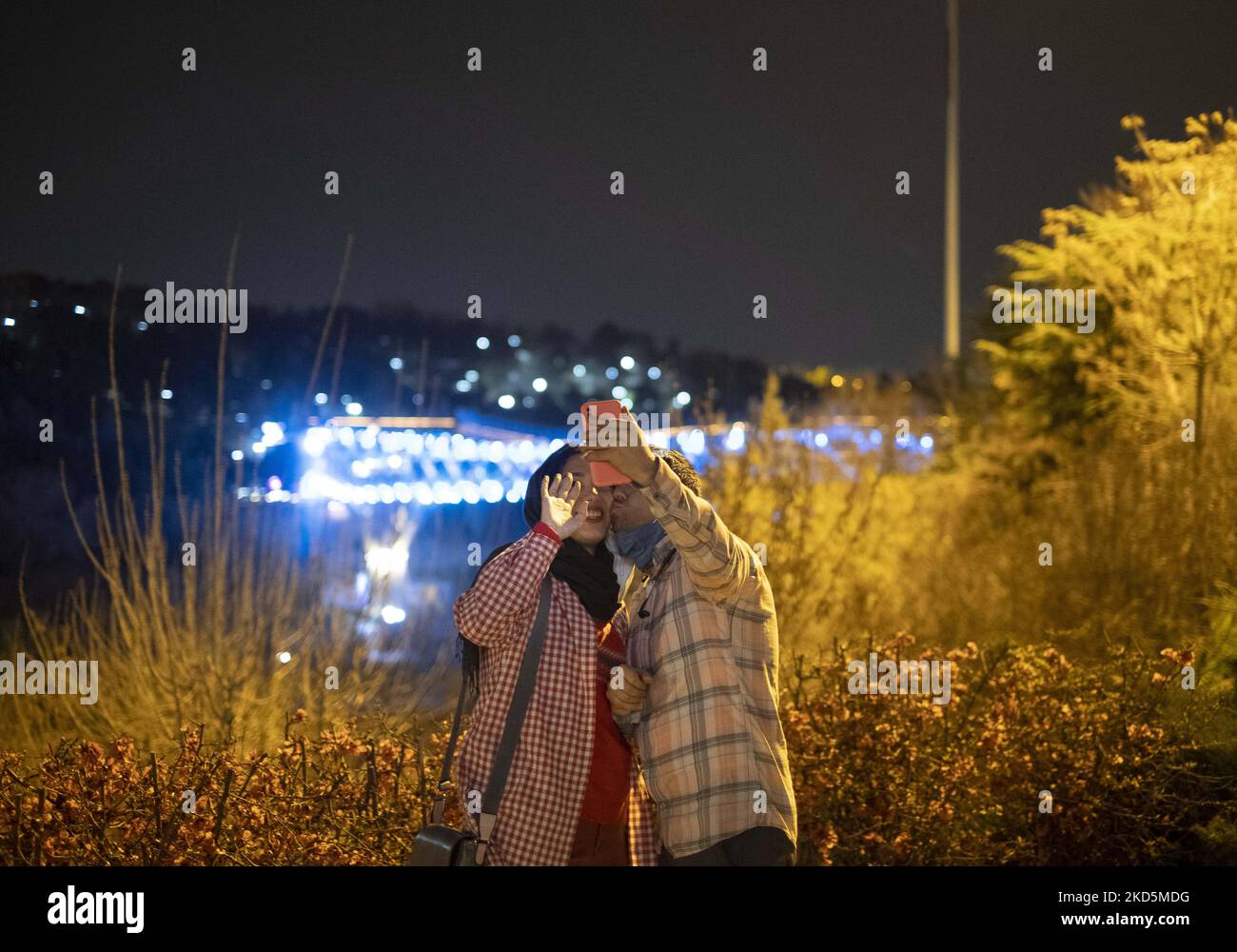 An Iranian couple kiss each other while video calling to congrats the ...