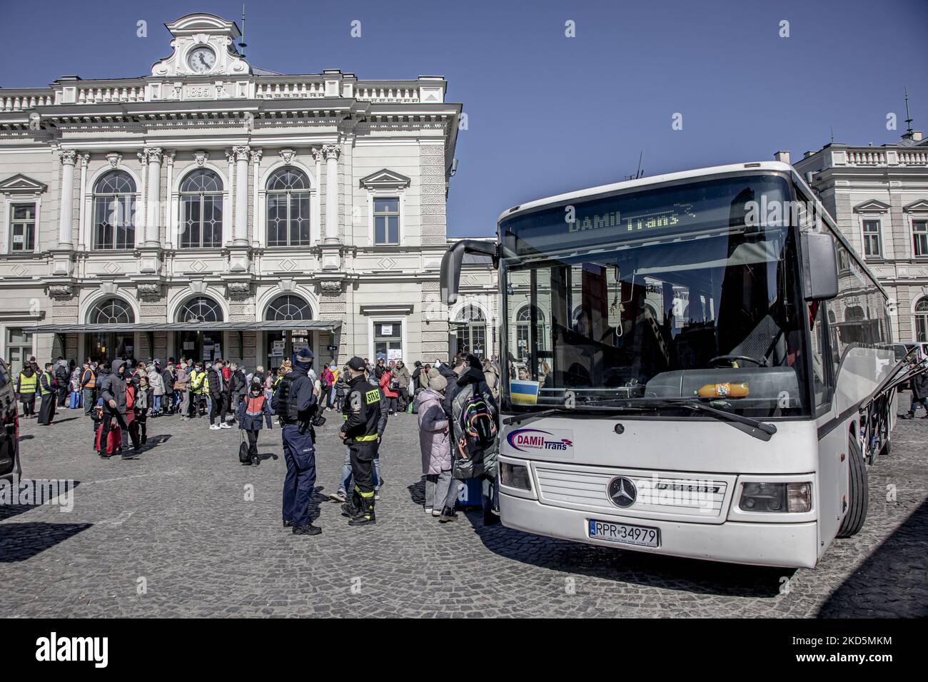 Crowd of people, refugees who fled Ukraine are seen getting in the bus ...