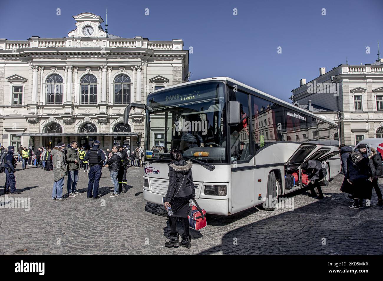 Crowd of people, refugees who fled Ukraine are seen getting in the bus ...