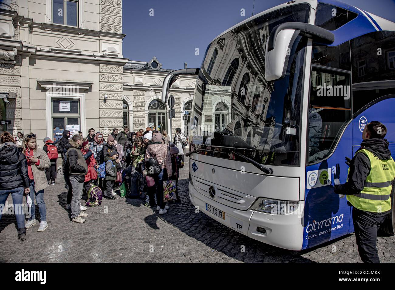 Crowd of people, refugees who fled Ukraine are seen getting in the bus ...