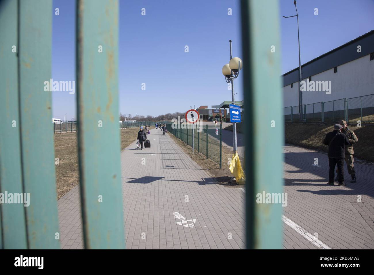 Civilian refugees just crossed the borders and arrive on foot at the ...