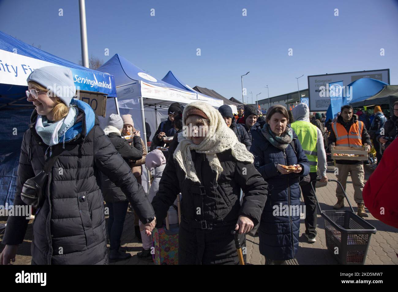 An old woman just entered Poland with her granddaughter holding her ...