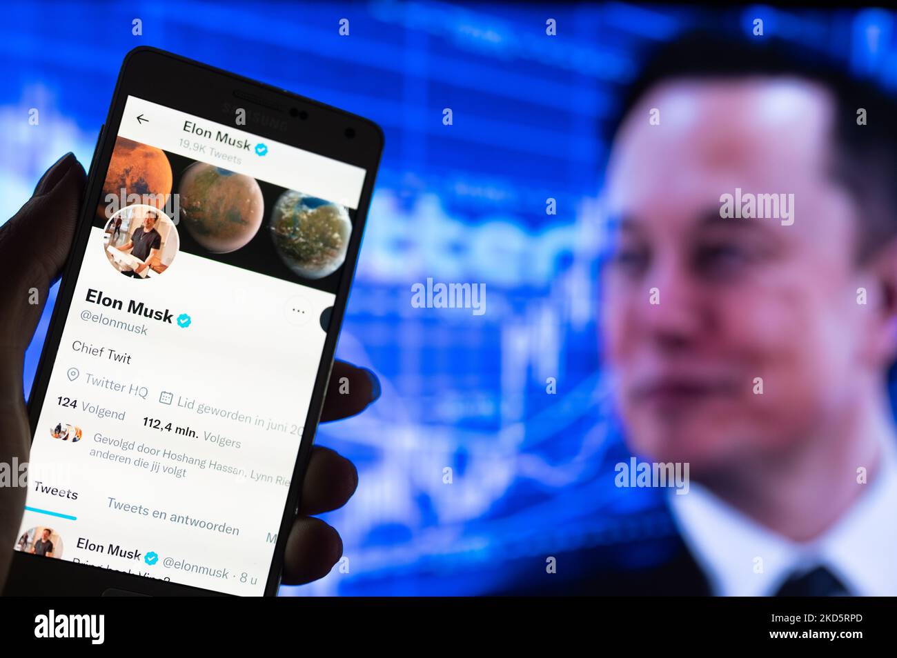 Elon Musk's Twitter account displayed on a screen are seen in this ...