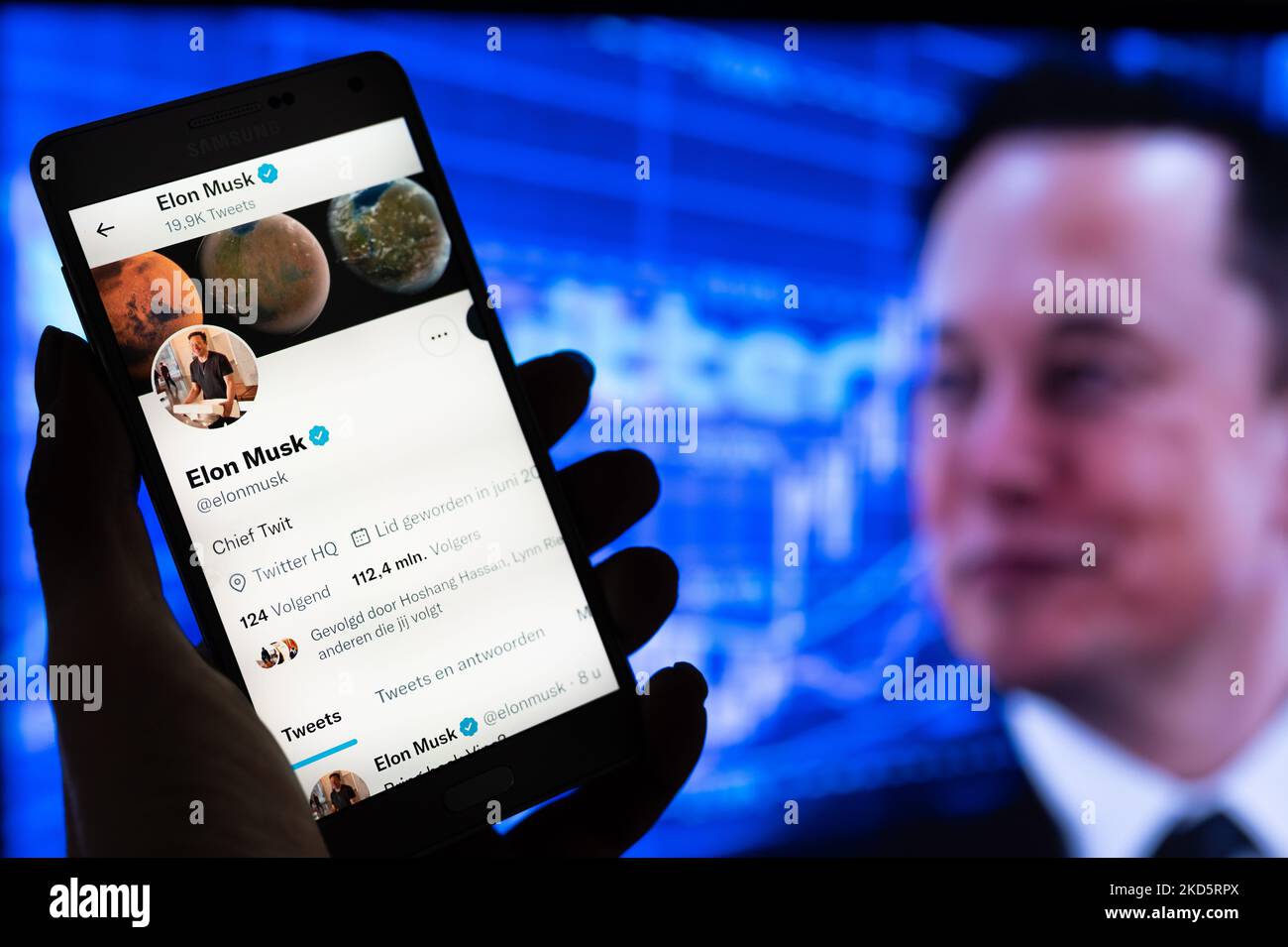 Elon Musk's Twitter account displayed on a screen are seen in this ...