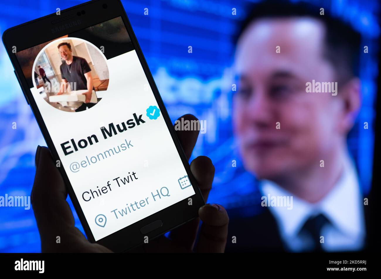 Elon Musk's Twitter account displayed on a screen are seen in this ...