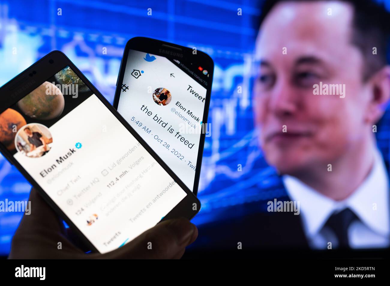 Elon Musk's Twitter account displayed on a screen are seen in this ...