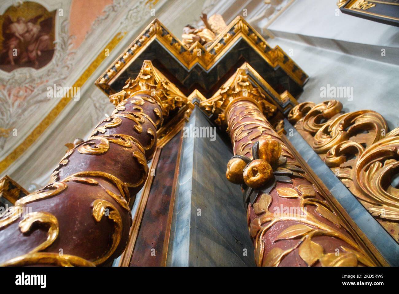 A low angle of church columns with golden decorations, Basilica Minore ...