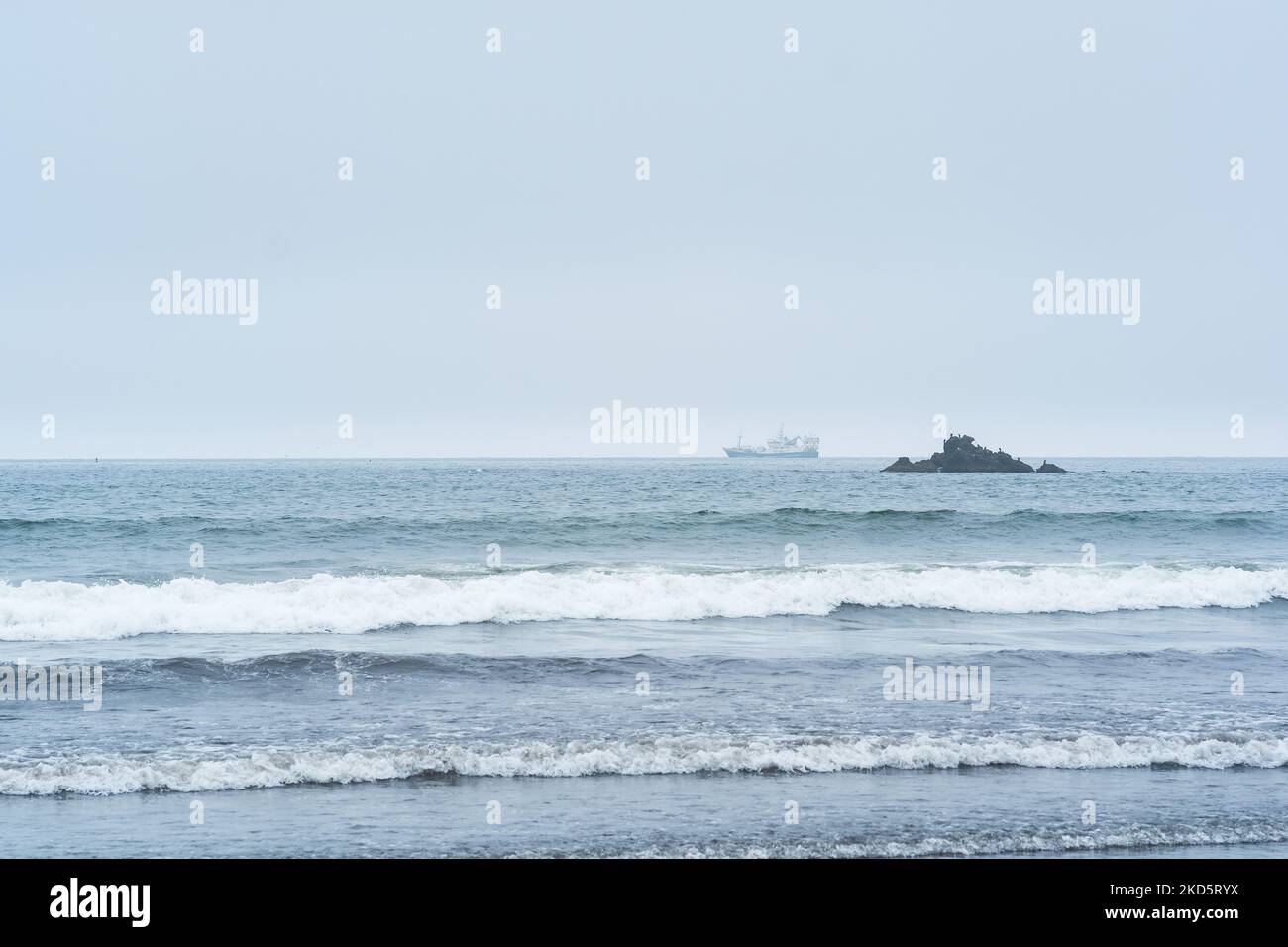 landscape with a sea rock and a sailing ship in the distance Stock ...