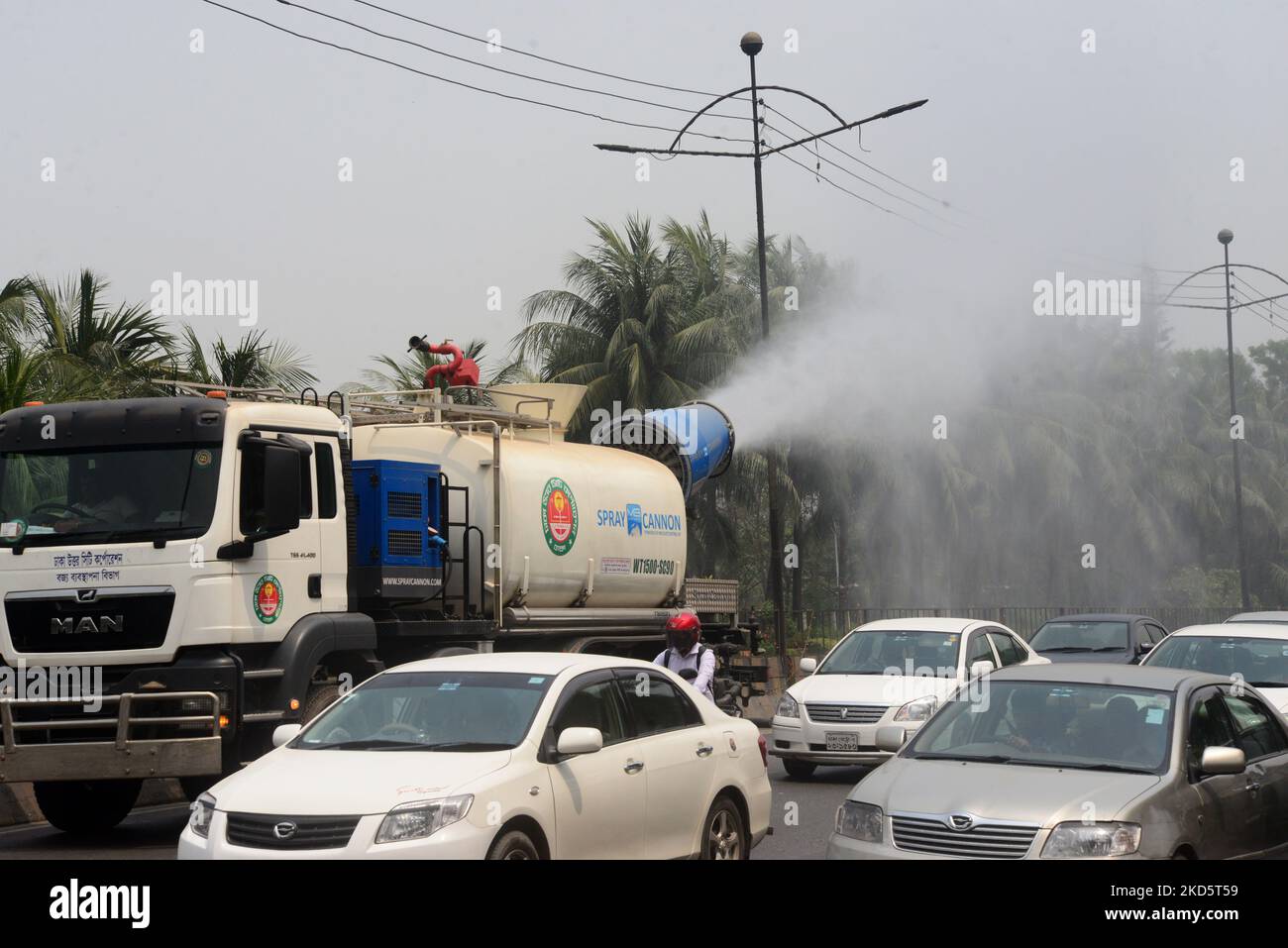Mist spray cannon spraying water to control dust as the city’s air ...