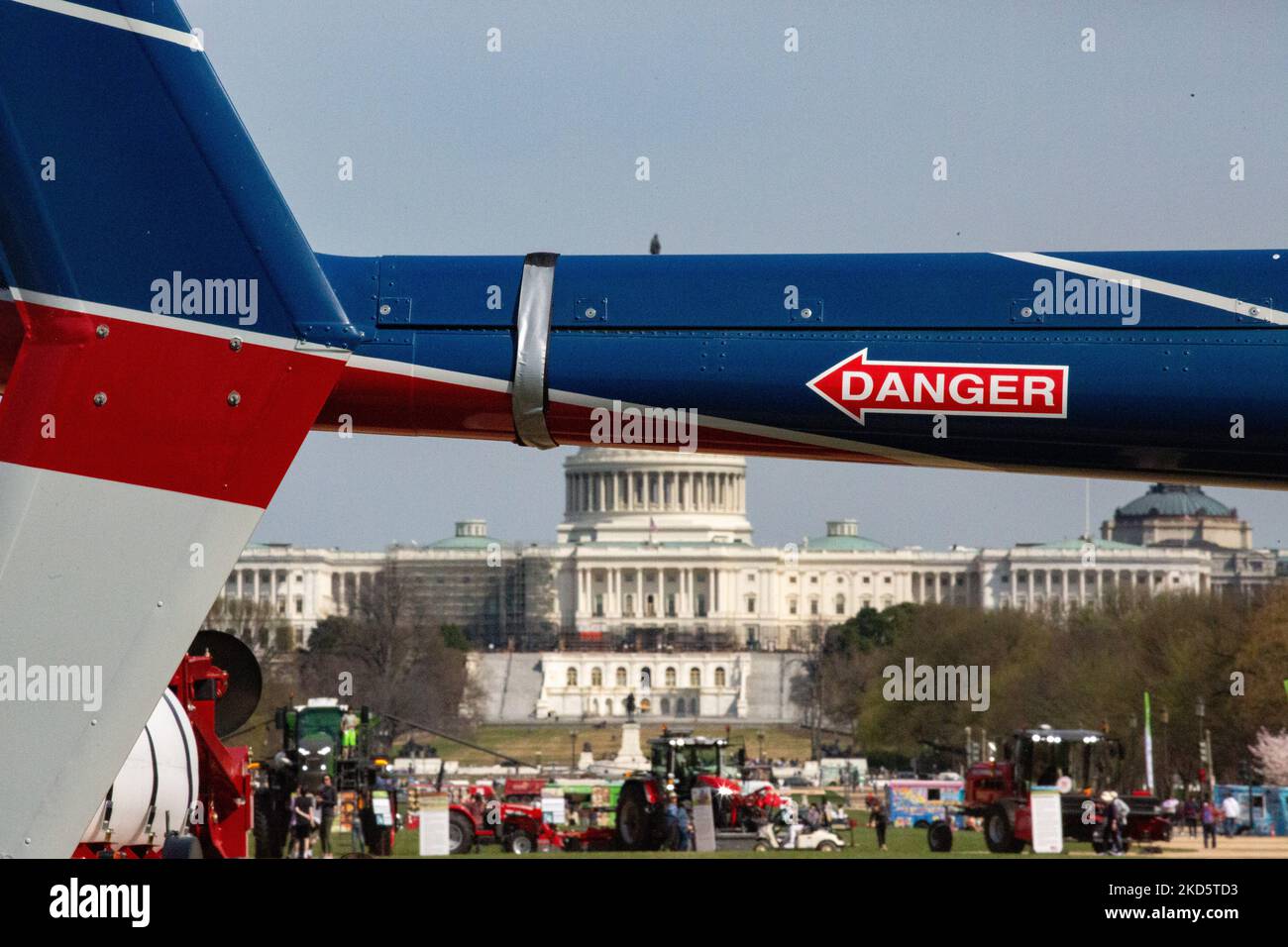 The U.S. Capitol is seen beyond a helicopter on display at the National ...