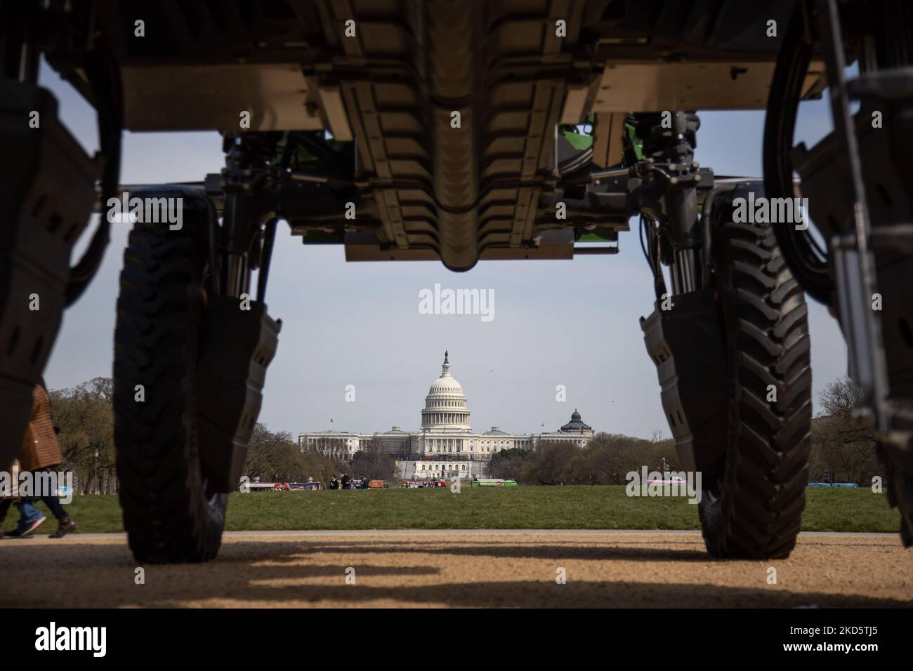 The U.S. Capitol is seen beyond farming equipment on display at the ...