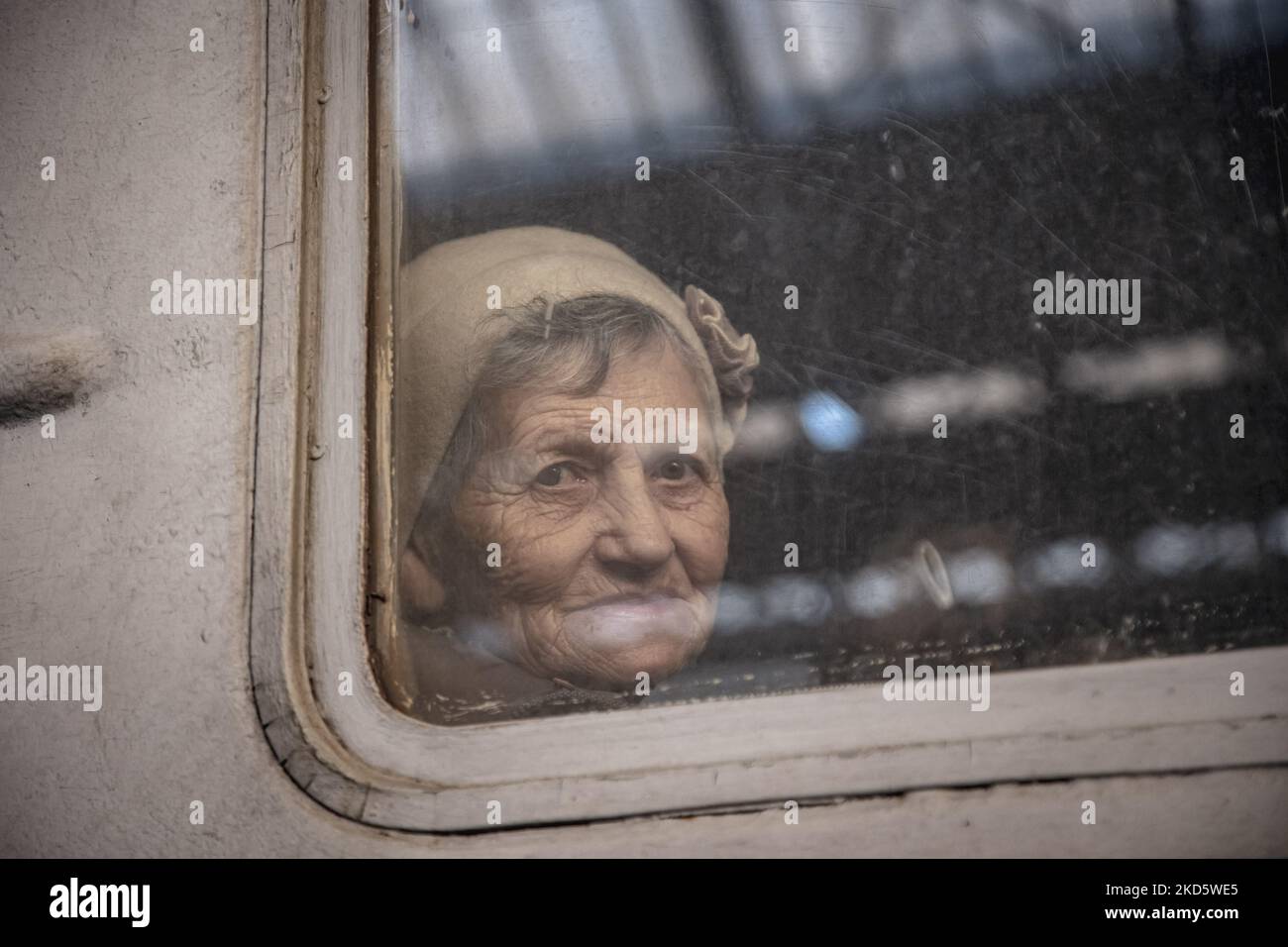 An old woman called Maria, people as seen through the train wagon ...